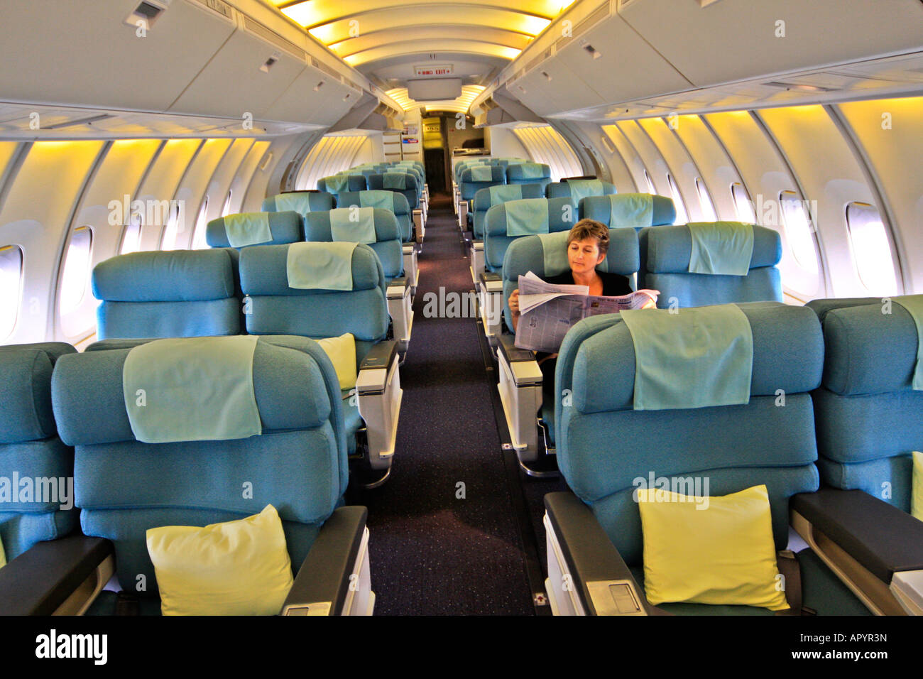 Reading newspaper in airplane hi-res stock photography and images - Alamy