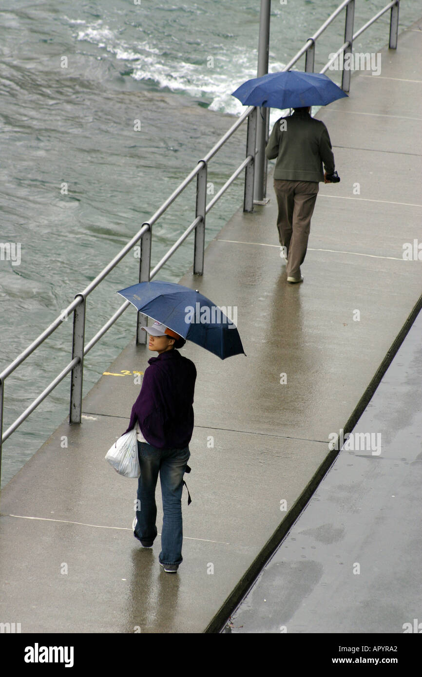 People with umbrellas in the rain Stock Photo - Alamy