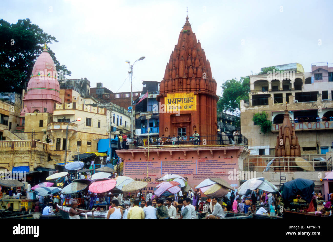 Morning gathering of locals at Prayag Ghat on the bank of the river ...