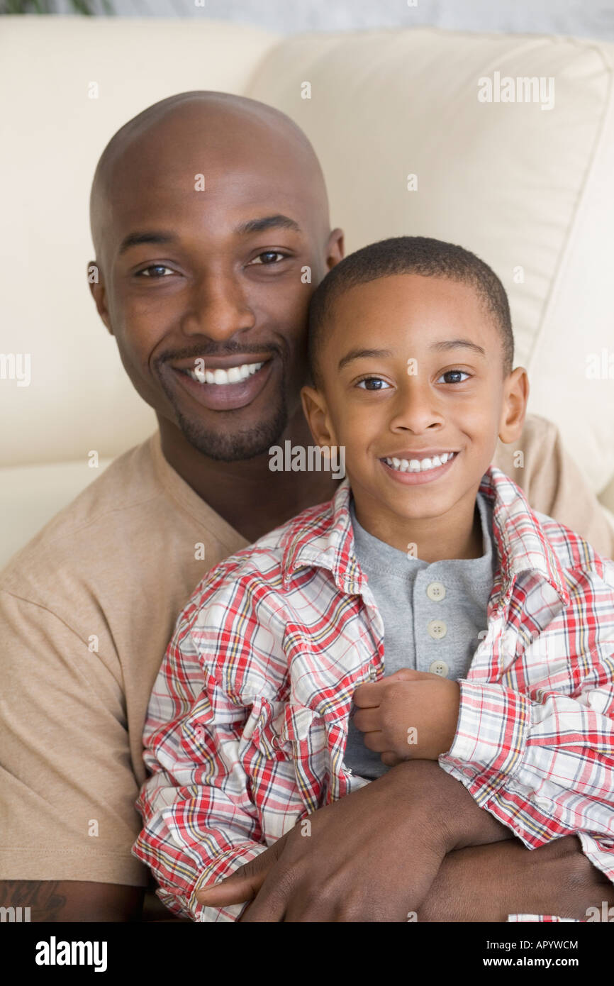 African father and son hugging Stock Photo - Alamy