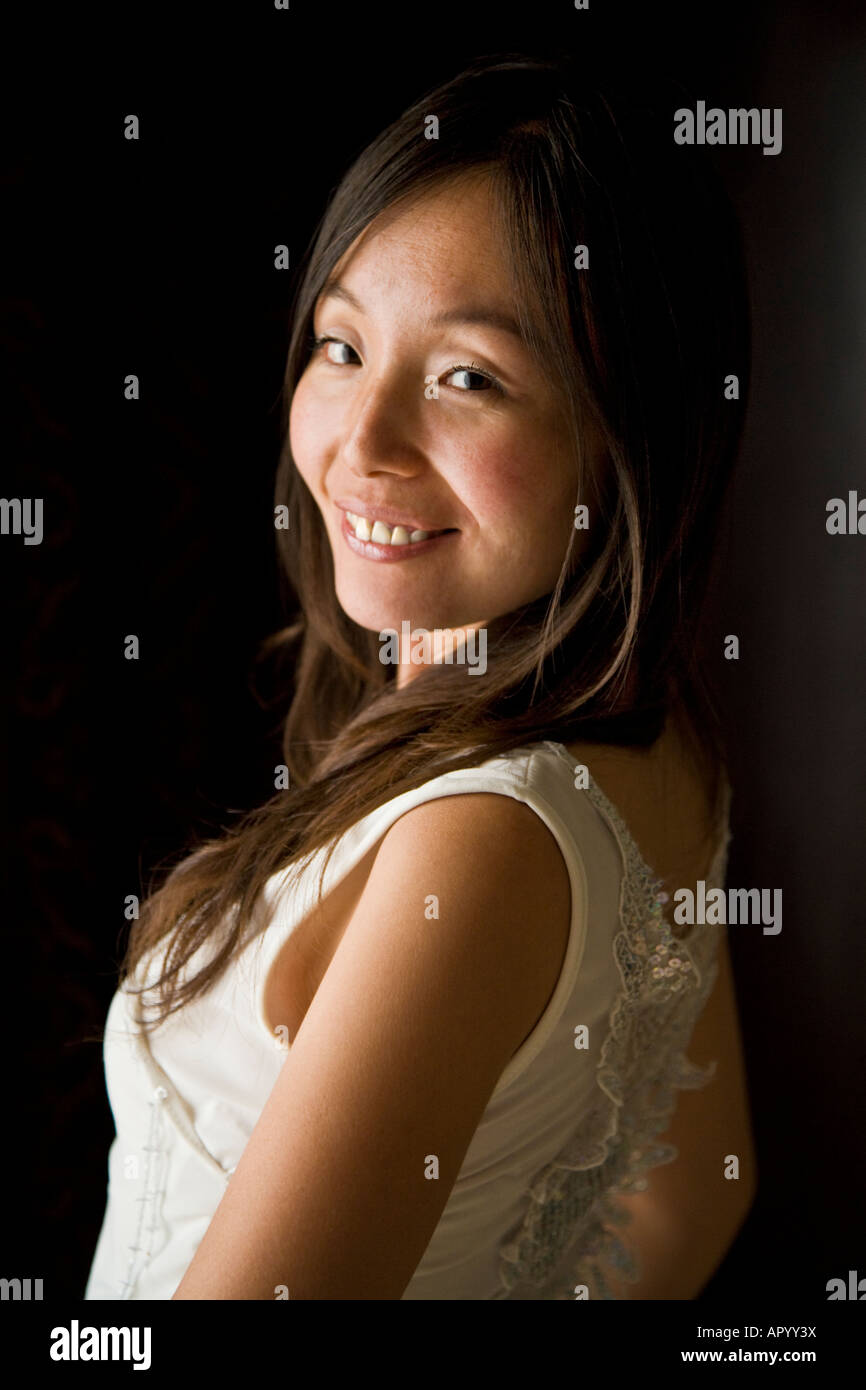 Over shoulder portrait beautiful asian oriental Chinese young woman ...