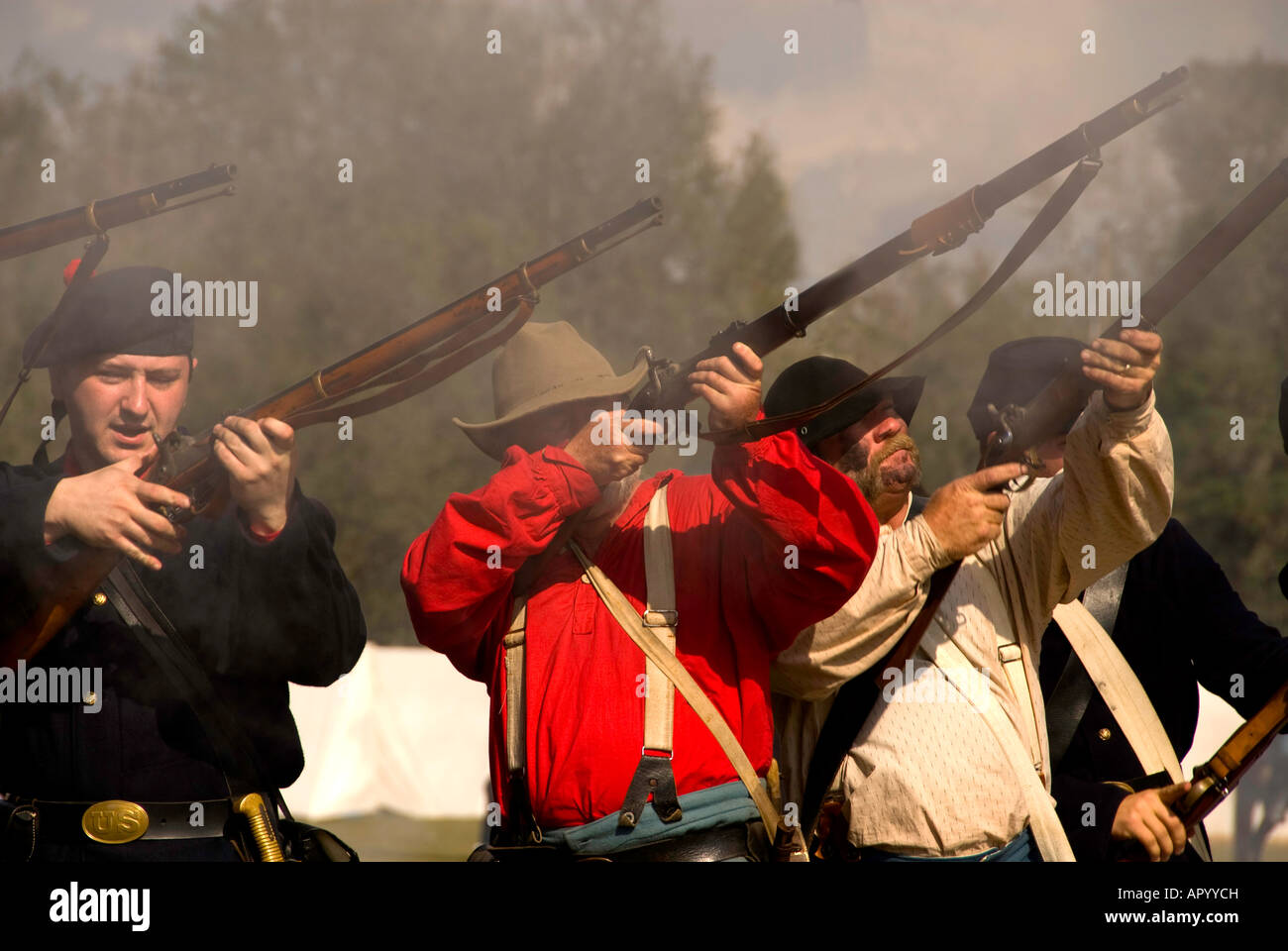 Troops rally on battlefield firing gunsat Civil War Re enactment Stock ...