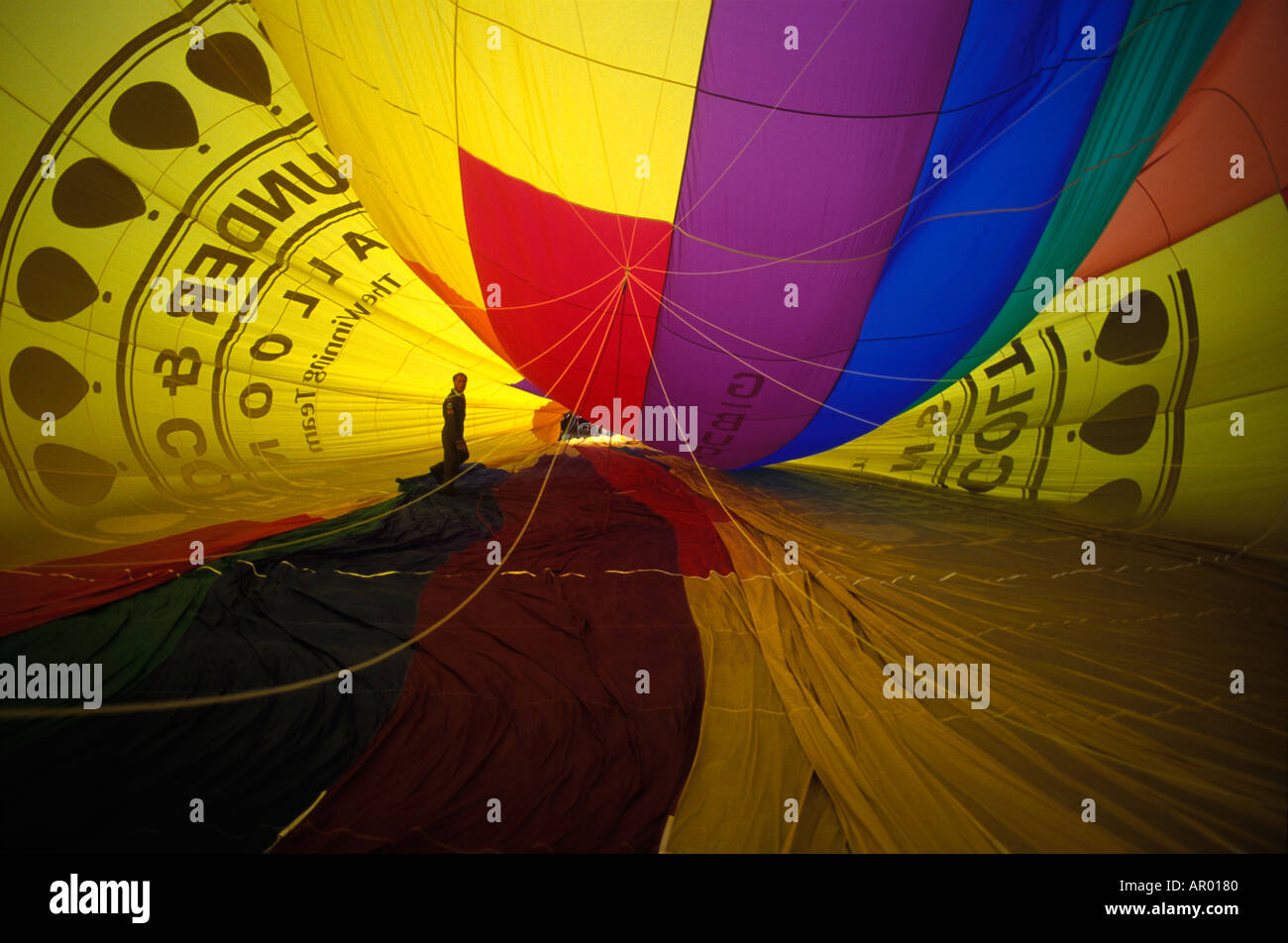 pilot checks the interior of his hot air balloon Stock Photo - Alamy