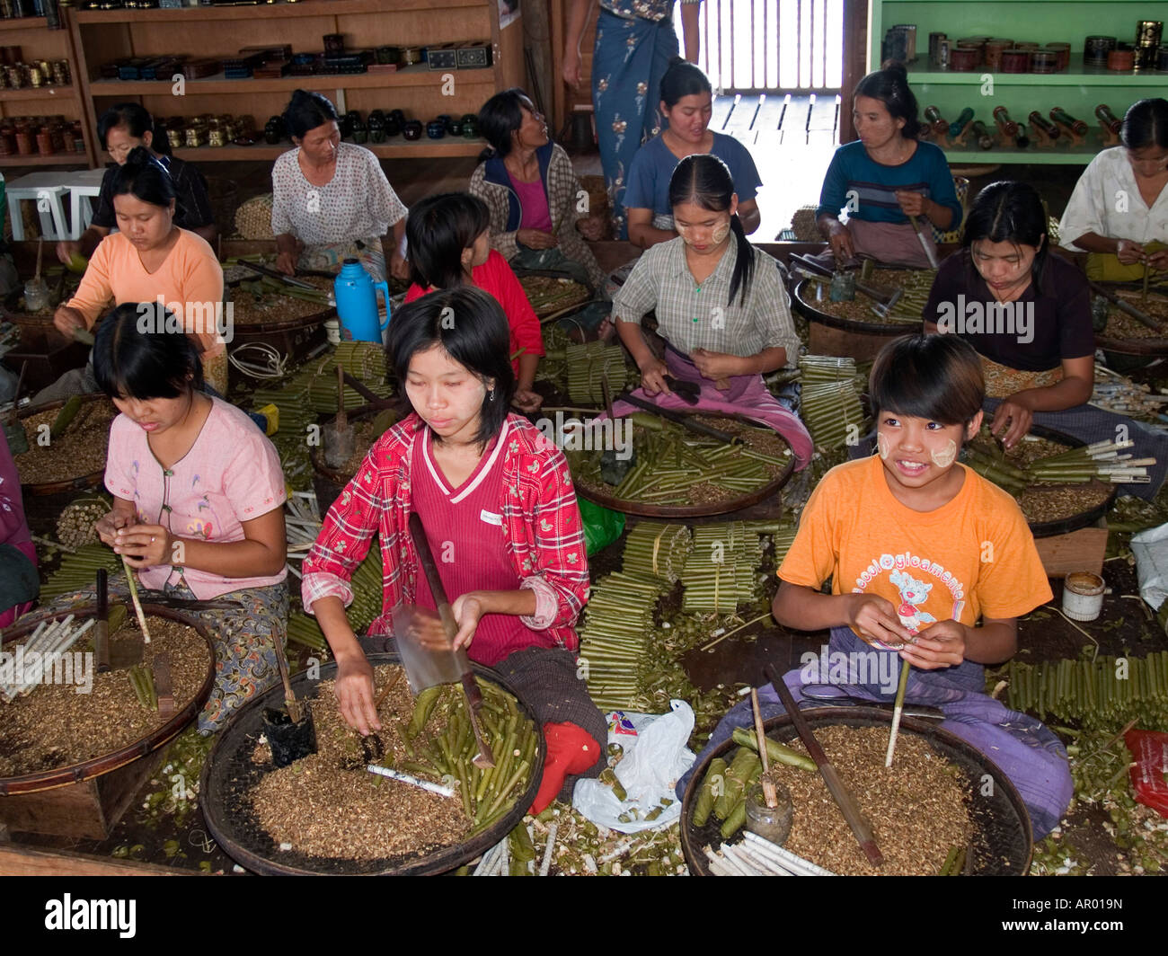 young girls working in a cheroot cigar making factory on Inle Lake in ...