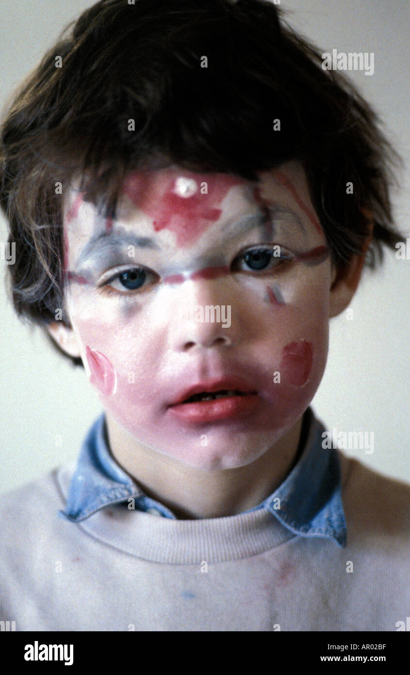 Serious looking boy with face paint Stock Photo - Alamy