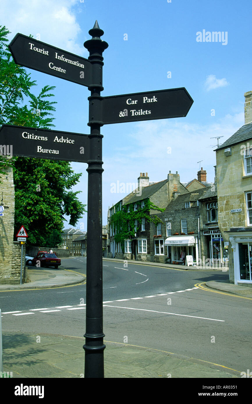 Sign post and stone buildings Oundle Northamptonshire England Stock ...