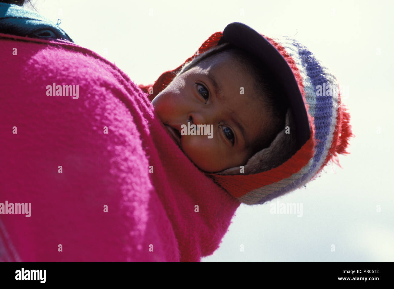 native South American baby in its mothers shawl Andes Mountains Ecuador ...