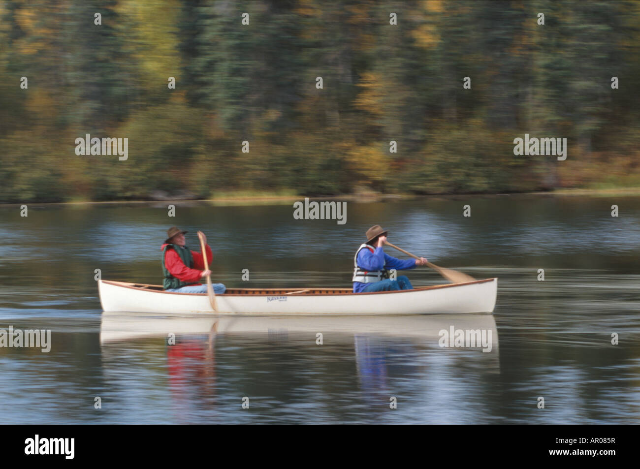 Two Woman Canoeing Byers Lake SC AK Fall Blurred Motion Stock Photo - Alamy