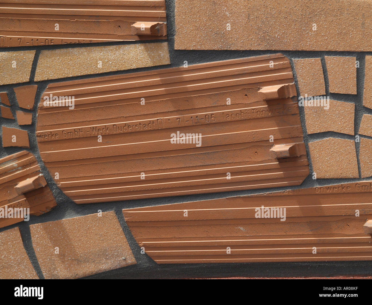 Roof tiles, worked into a wall Stock Photo - Alamy