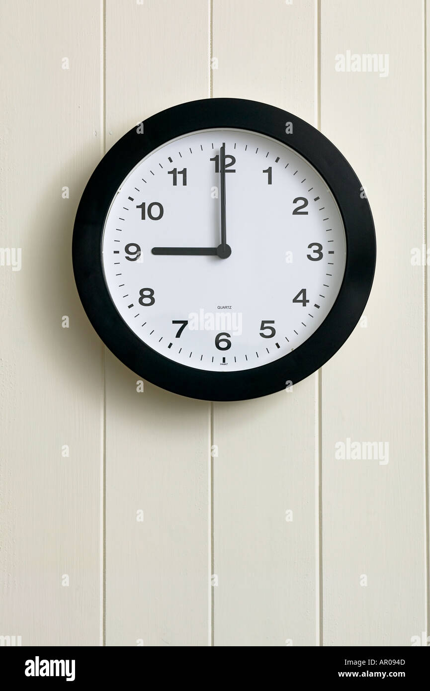 wall clock showing time at nine o clock 0900 2100 Stock Photo - Alamy