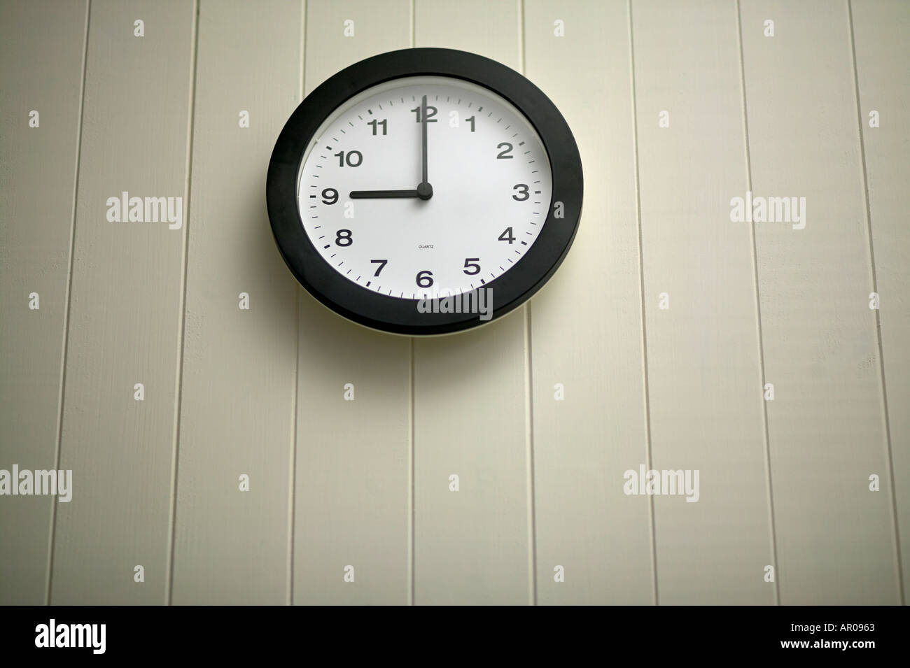 wall clock showing time at nine o clock 0900 2100 Stock Photo - Alamy
