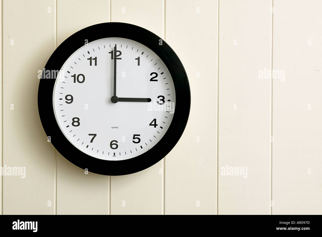 wall clock showing time at three o clock 0300 1500 Stock Photo - Alamy