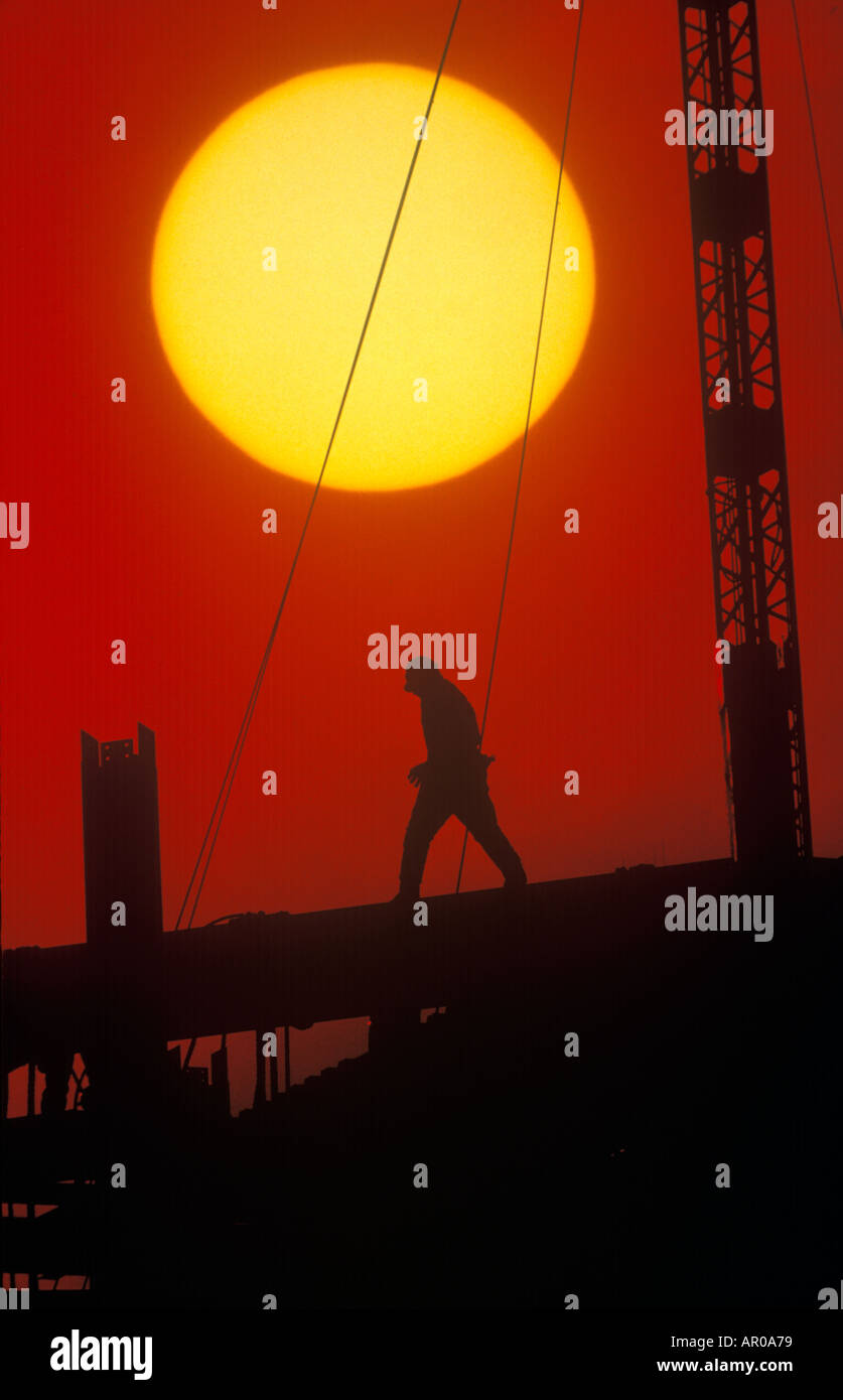 High Steel Construction workers at sunset Stock Photo - Alamy