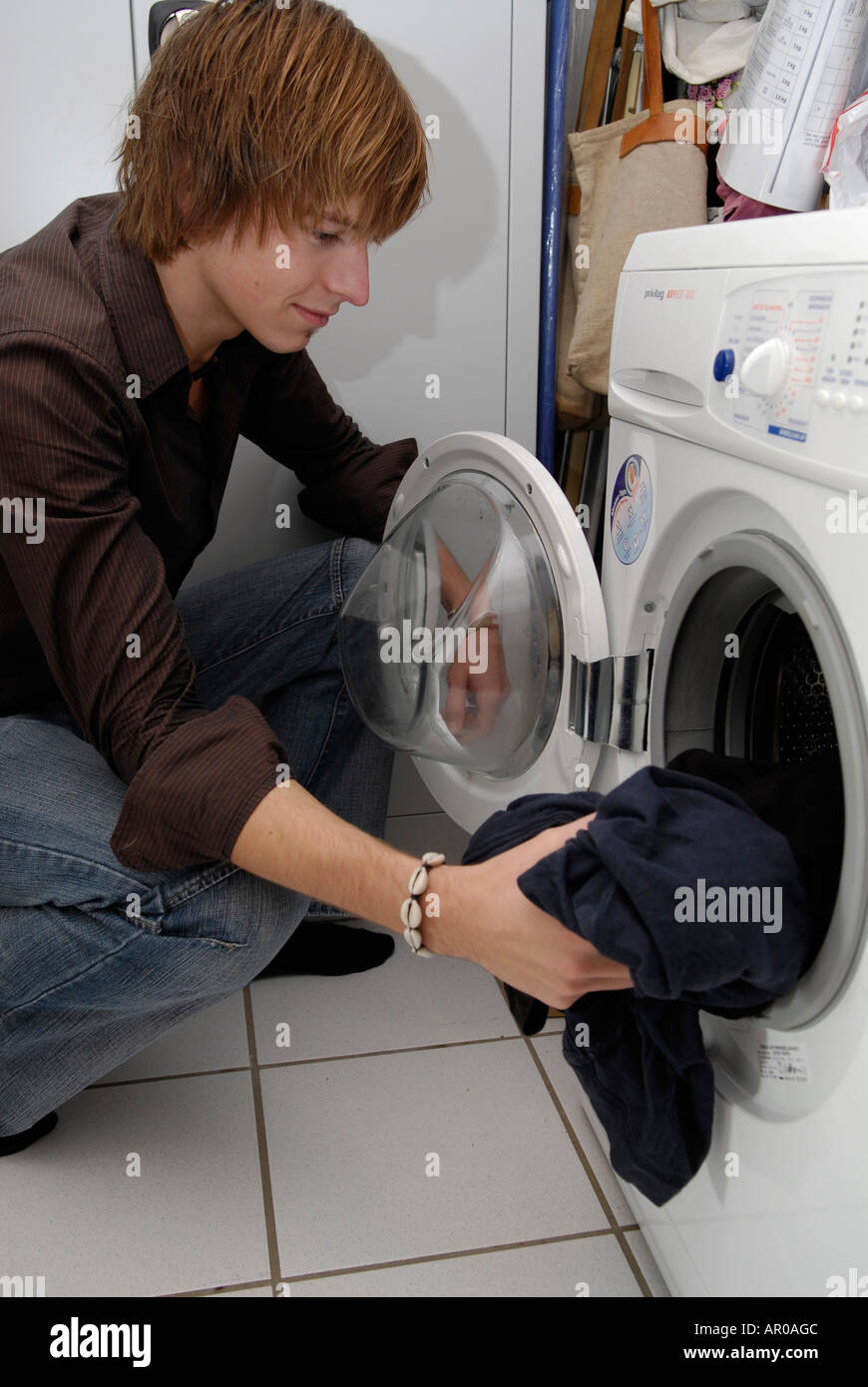 Man at washing machine Stock Photo - Alamy