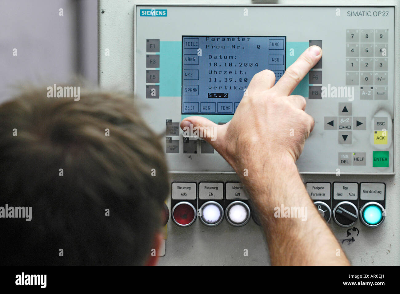 Operating a computer numeric controlled - CNC machine Stock Photo - Alamy