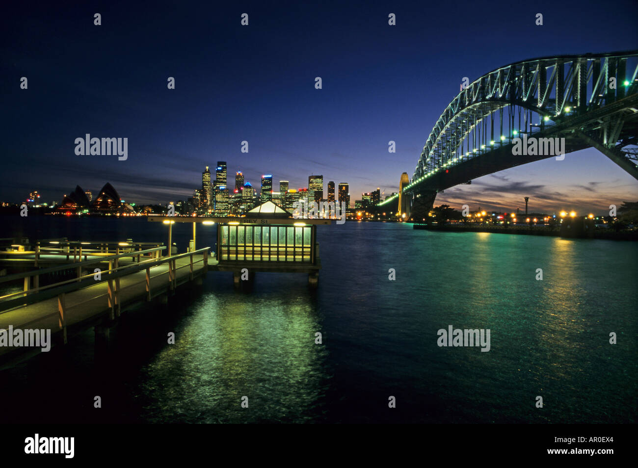 Sydney Harbour Bridge, at sundown. Jeffrey Street Wharf, North Shore ...