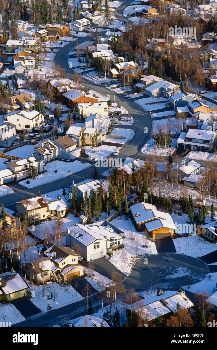 Aerial of neighborhood subdivision Anchorage AK winter homes & street ...