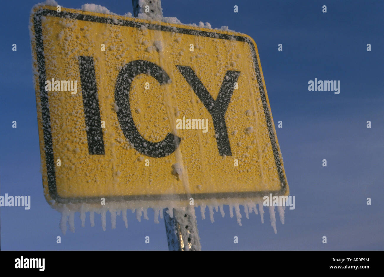Icy Road Sign Covered with Frost & Ice Winter Alaska Stock Photo - Alamy
