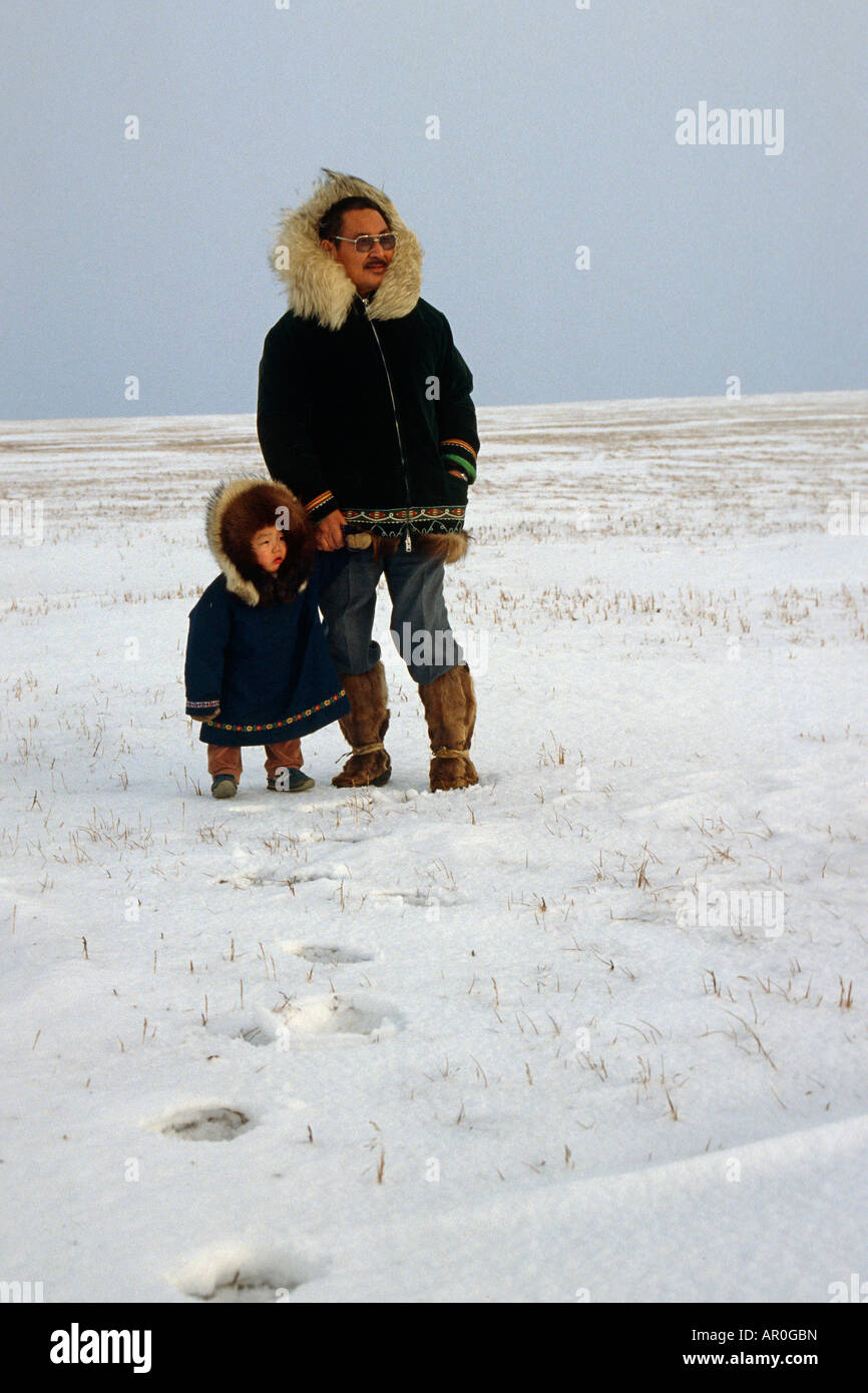 Eskimo Man & Child on winter tundra Arctic Alaska Stock Photo - Alamy