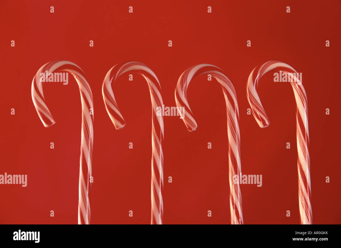 Four Red Candy Canes in a Row Studio Still life Stock Photo - Alamy