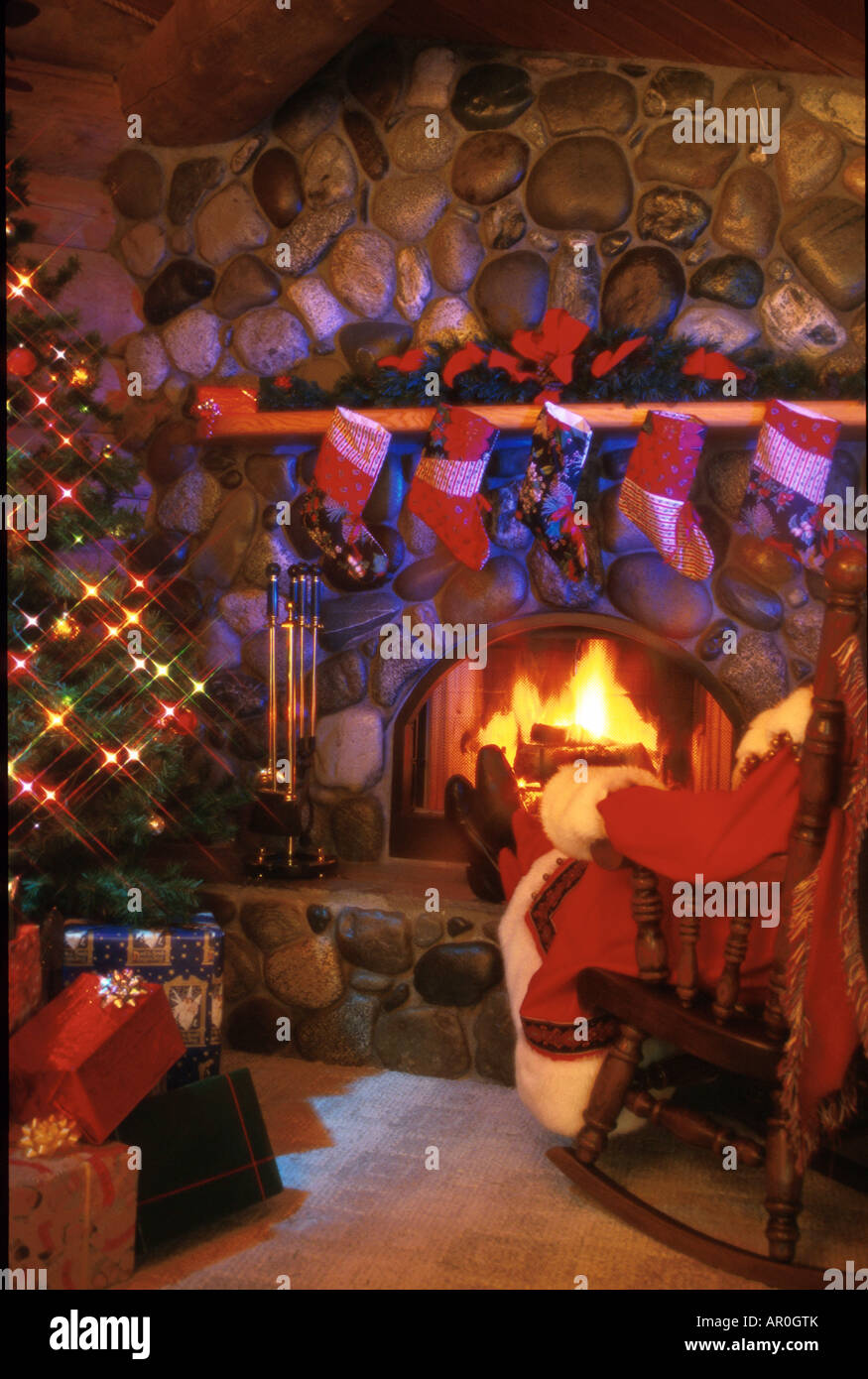 Santa Sleeping in Chair Fireplace & Christmas Tree Stock Photo - Alamy