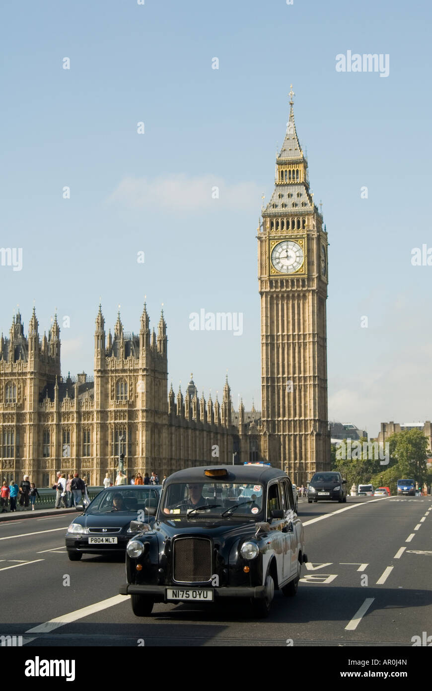 Black taxi cab passing Big Ben and the Houses of Parliament London ...