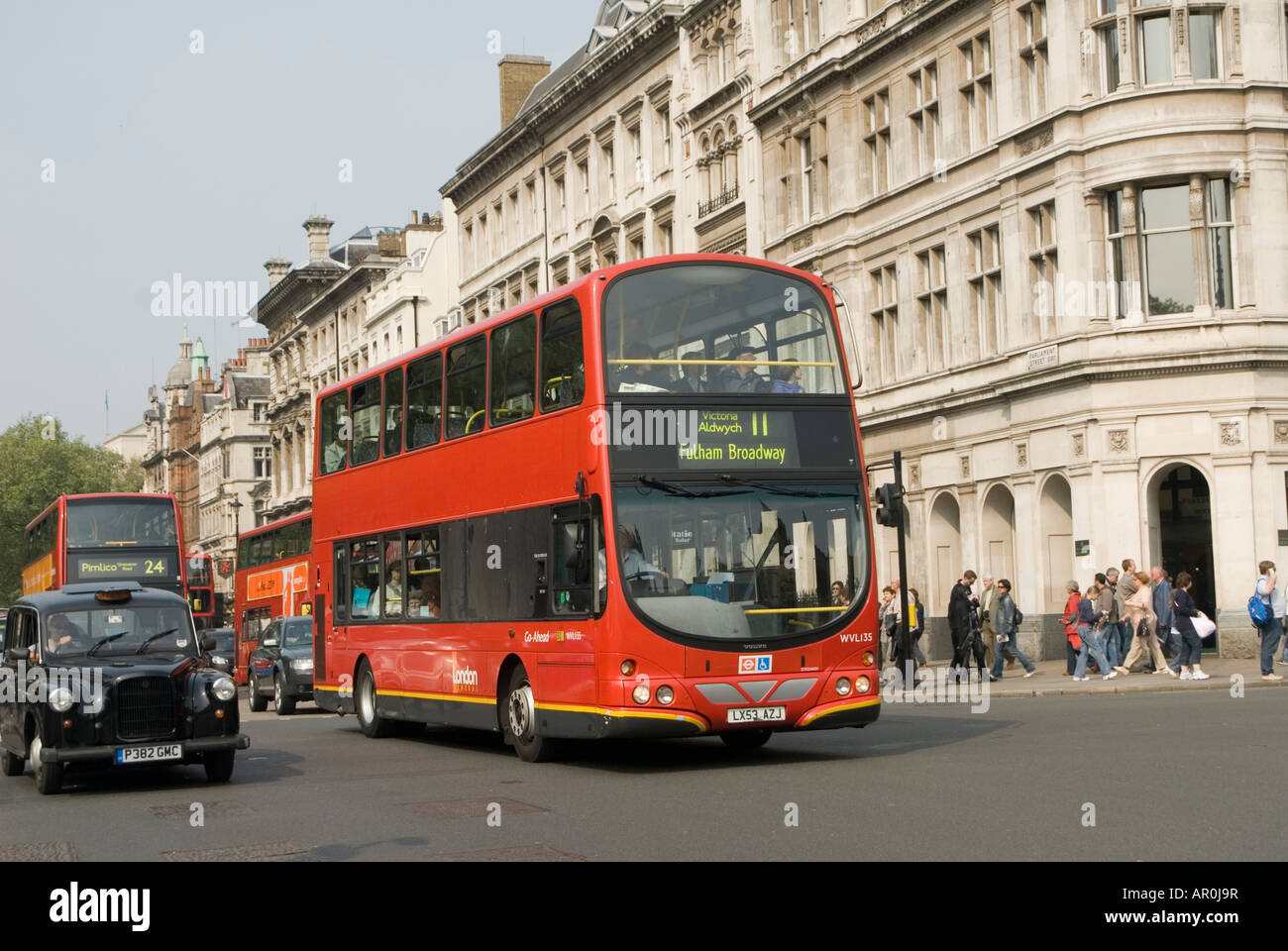 Red double decker London Bus in london traffic Stock Photo - Alamy