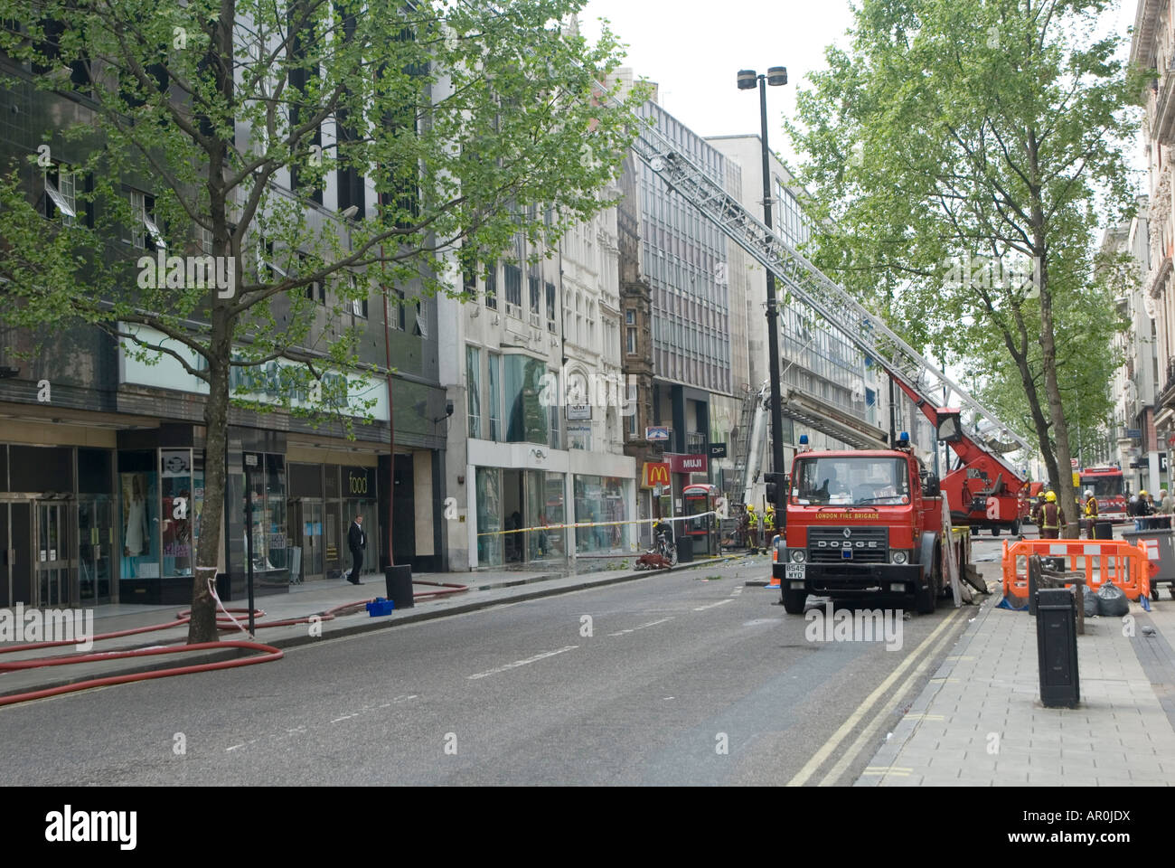 London Fire Service engine with extending ladder in Oxford Street ...