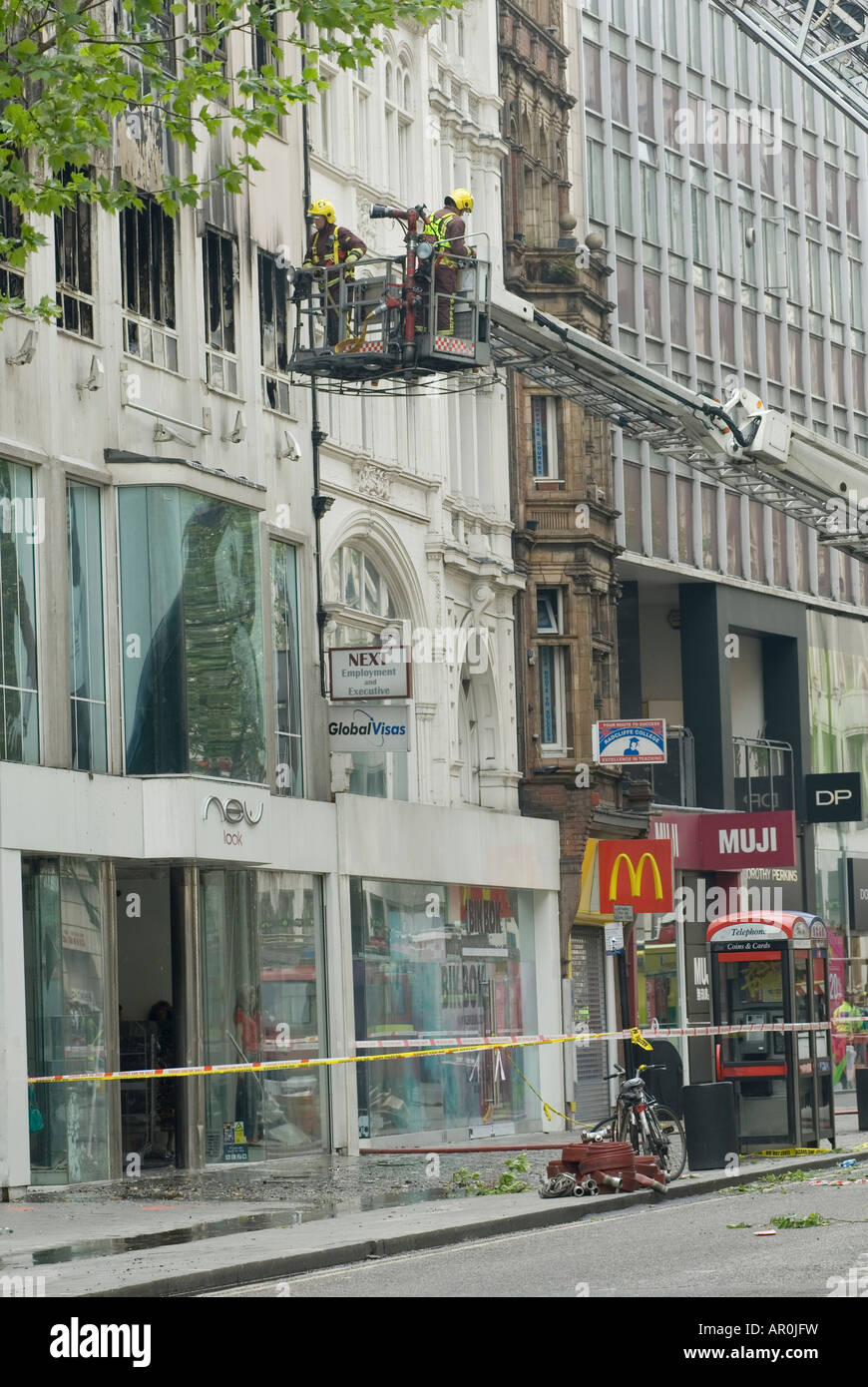 London Fire Service firemen on an extendable ladder England Stock Photo ...