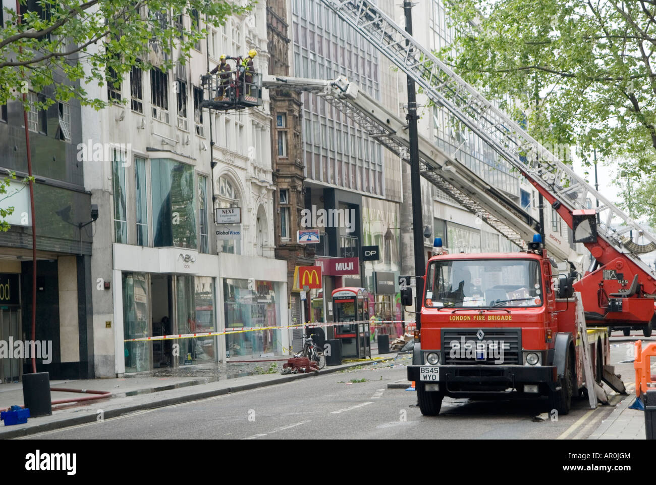 London Fire Service firemen on an extendable ladder England Stock Photo ...