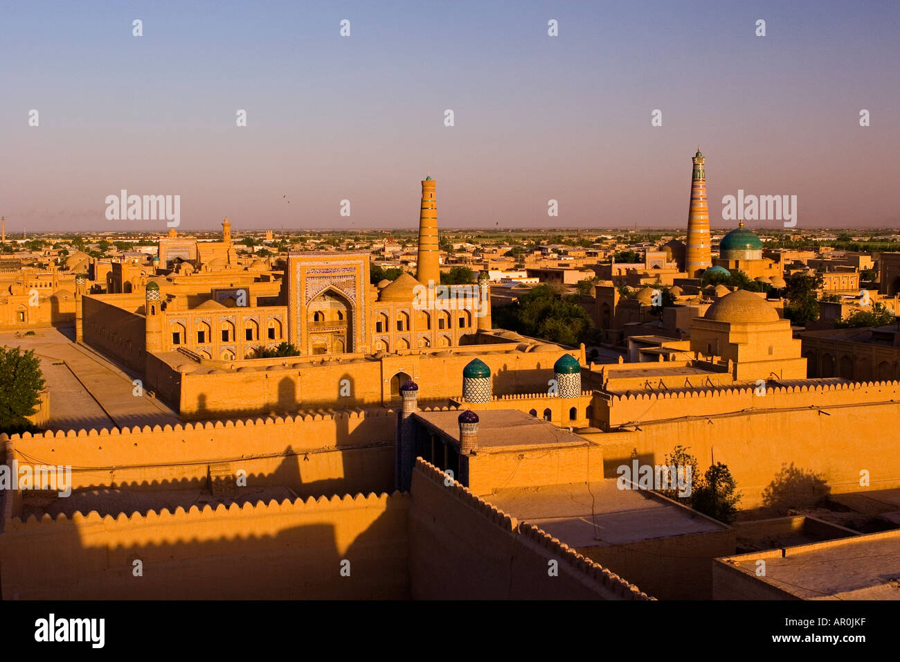Panorama of the mud brick city of Khiva at sunset Khiva Uzbekistan ...