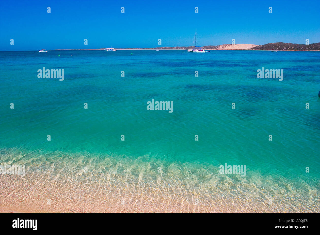 The stunning blue waters of Coral Bay in Ningaloo Marine Park Western ...