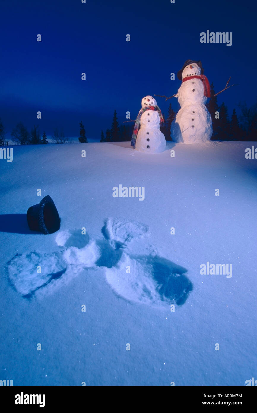 Two Snowmen and Snow Angel Alaska Winter Stock Photo - Alamy