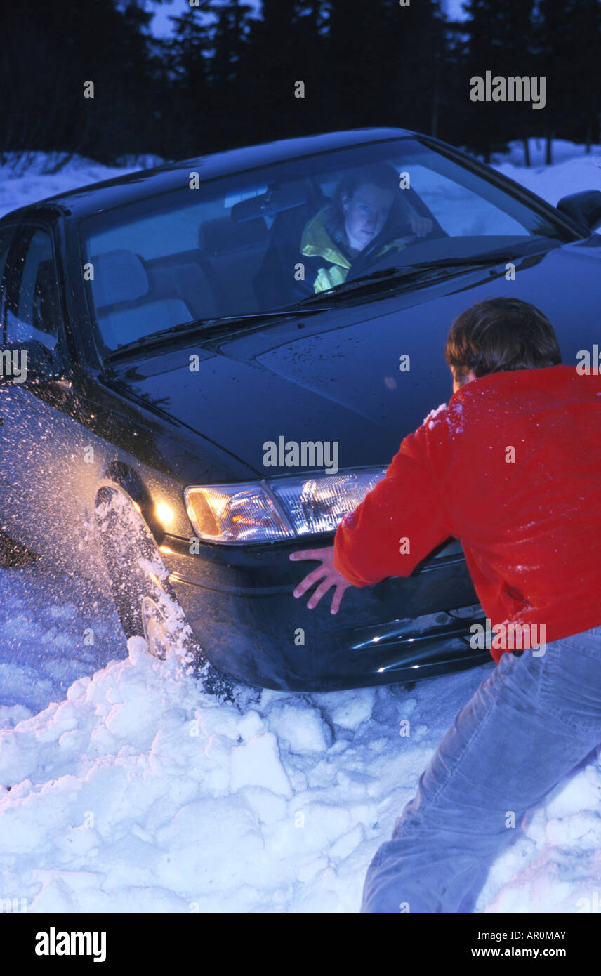 People pushing car stuck in hi-res stock photography and images - Alamy