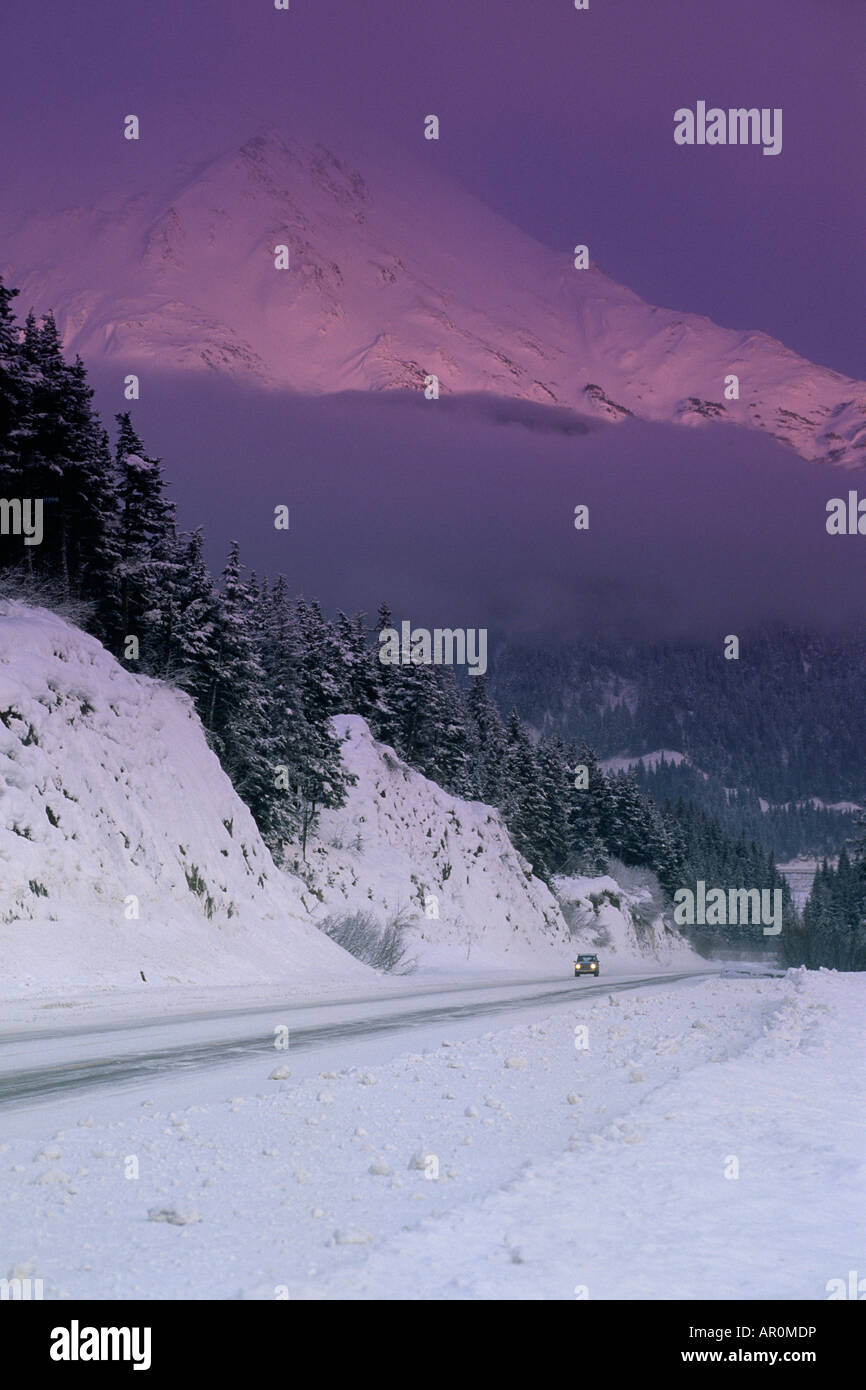 Car drives in winter Turnagain Pass KP AK Stock Photo - Alamy