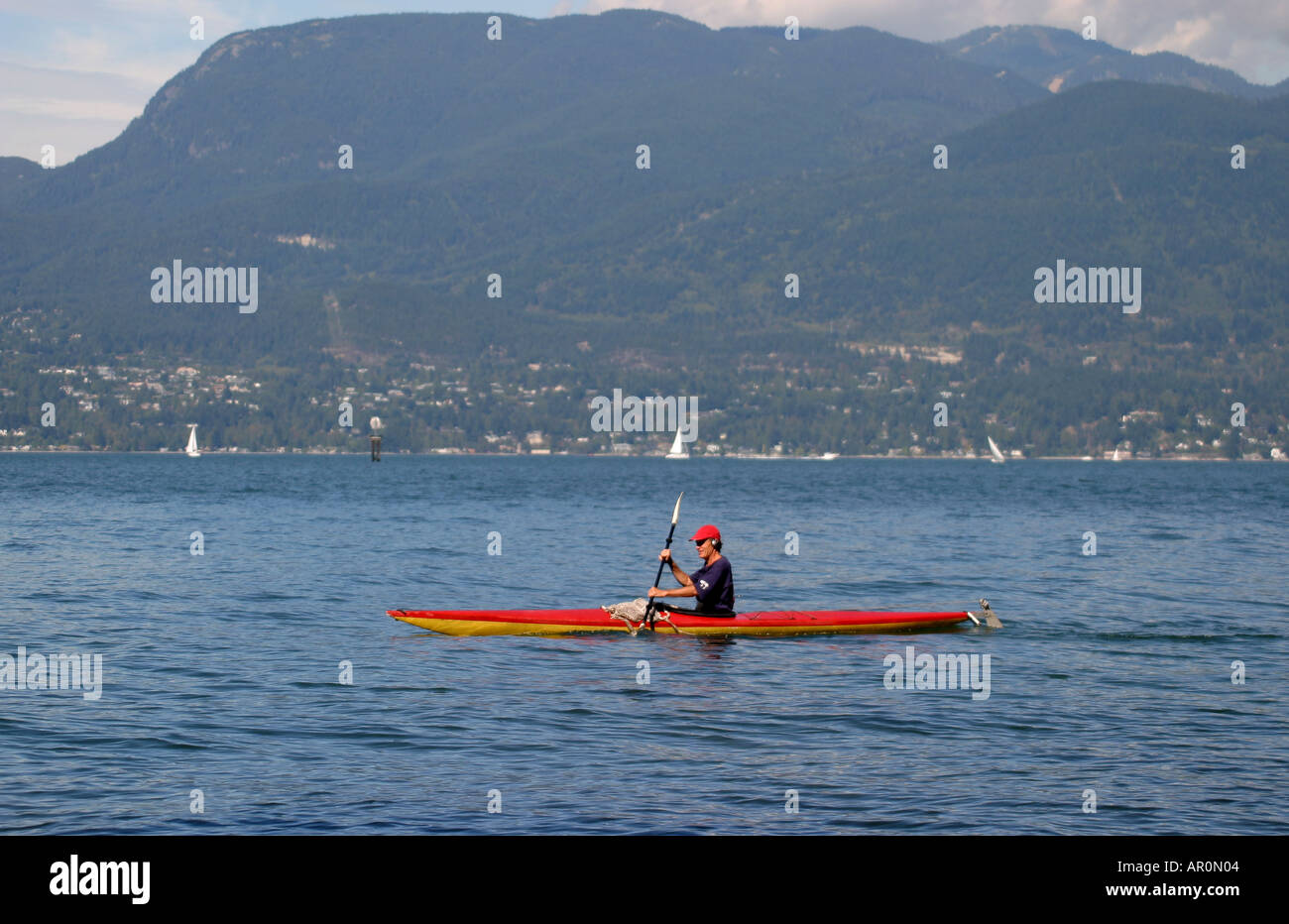 KAYAKING on a calm sea Stock Photo - Alamy