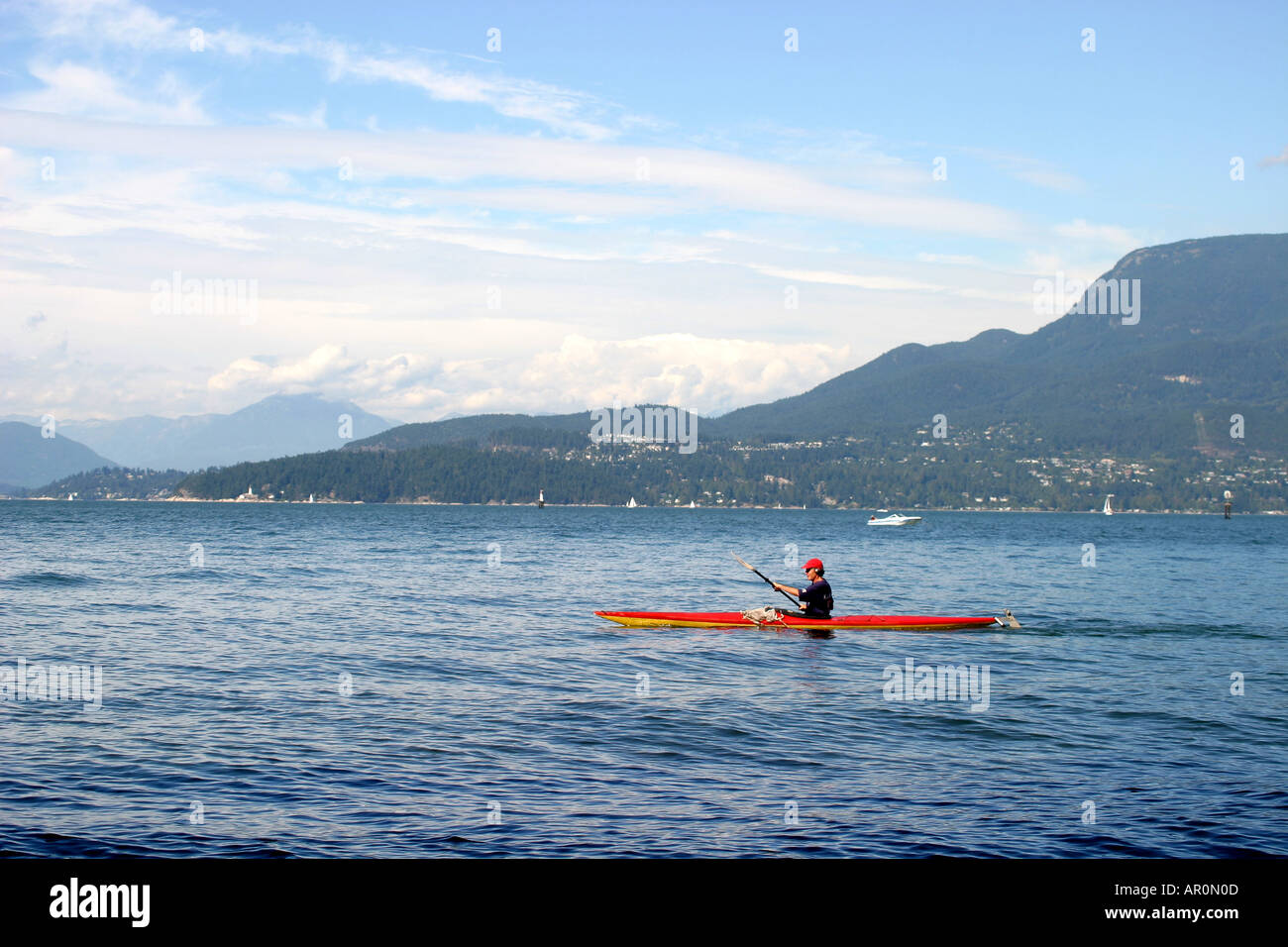 KAYAKING on a calm sea Stock Photo - Alamy