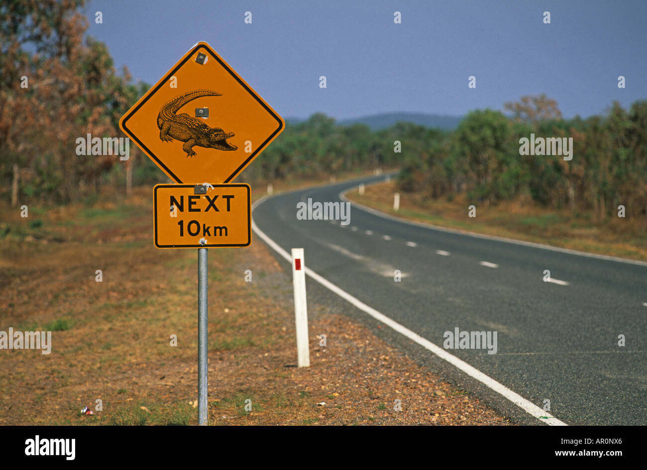 Crocodile warning sign, on the roadside, National Park, Queensland ...