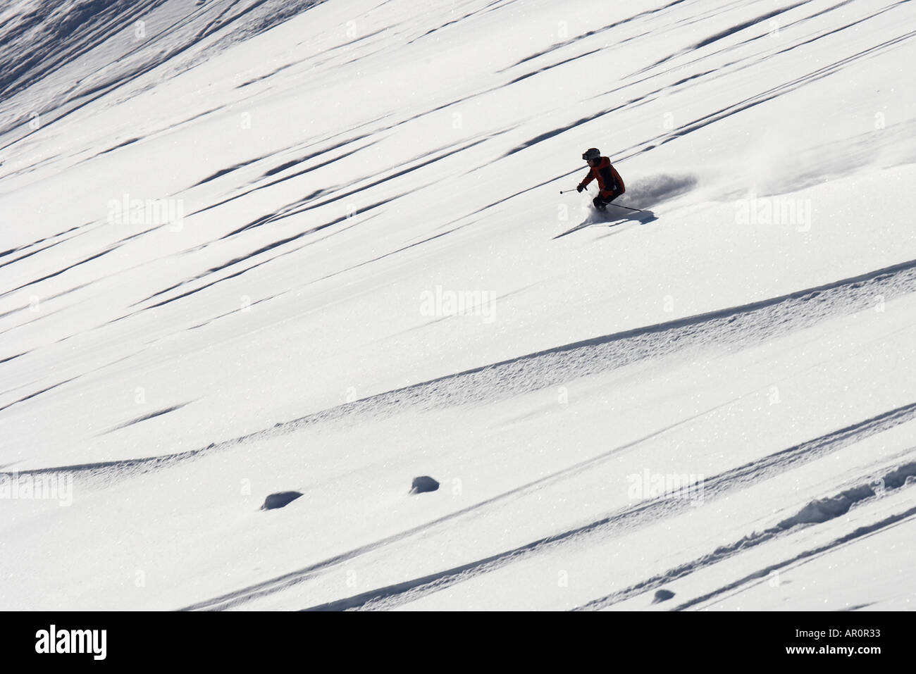Skier going down steep slope hi-res stock photography and images - Alamy
