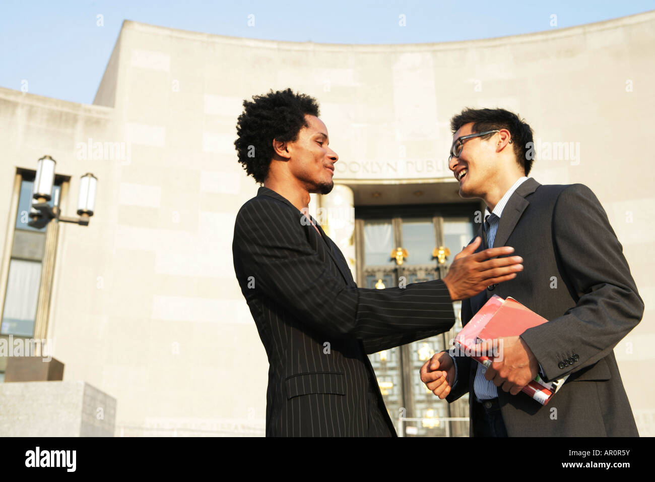 Two men greeting each other Stock Photo - Alamy