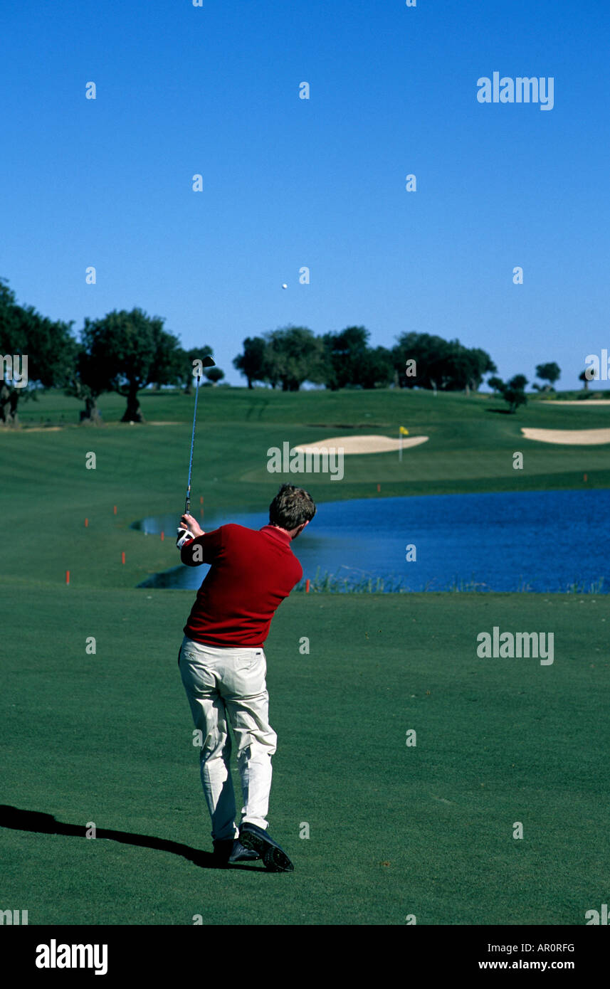 A golfer plays an approach shot during a round of golf at Quinta da Ria ...