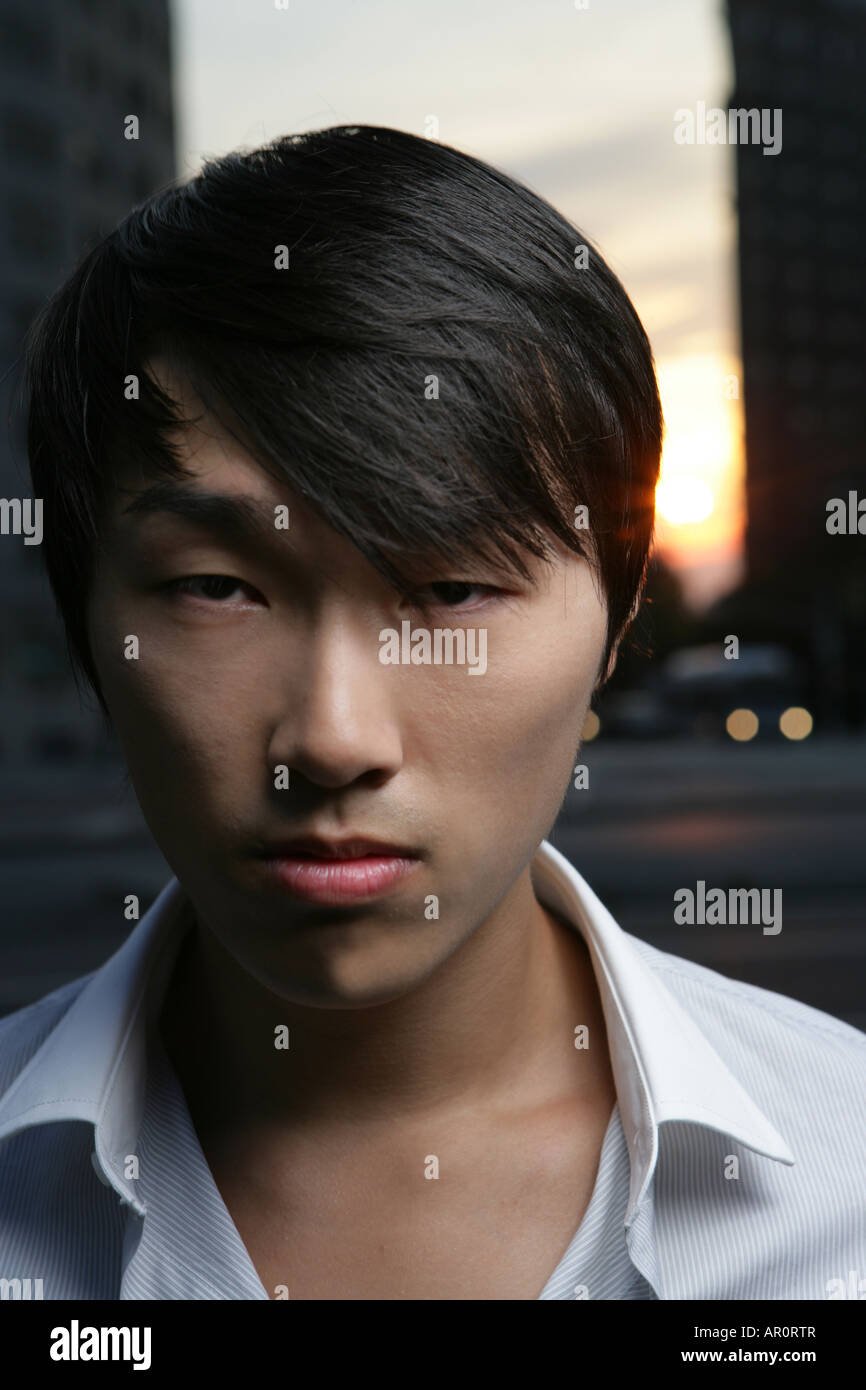 Portrait of an Asian man, looking at camera Stock Photo - Alamy