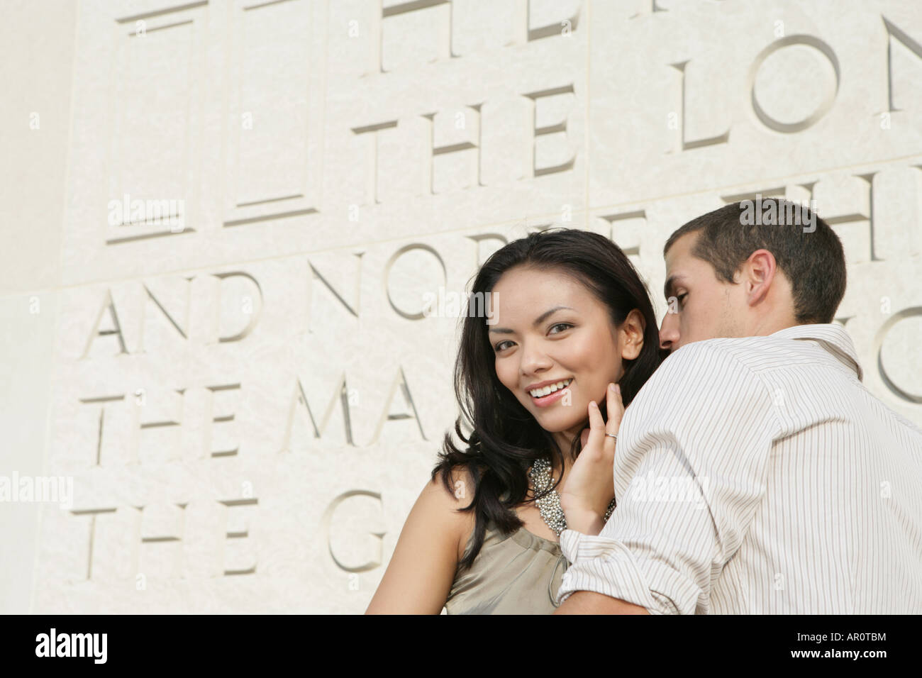 Filipino woman talking to caucasian man outside Stock Photo - Alamy