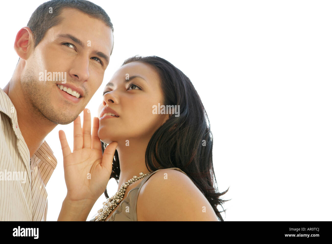 filipino woman whispering talking to caucasian man outside Stock Photo ...