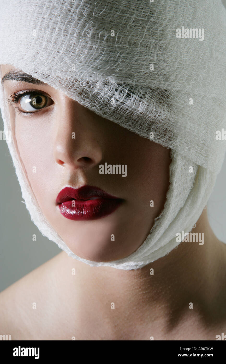 Close-up of a woman with her head bandaged Stock Photo - Alamy
