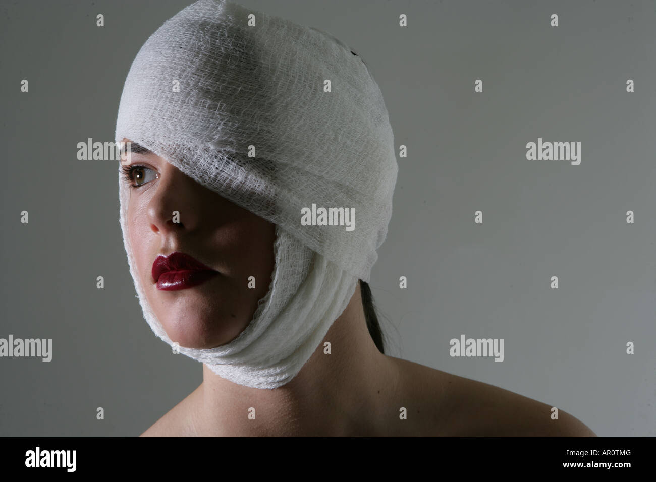 Woman with her head bandaged Stock Photo - Alamy
