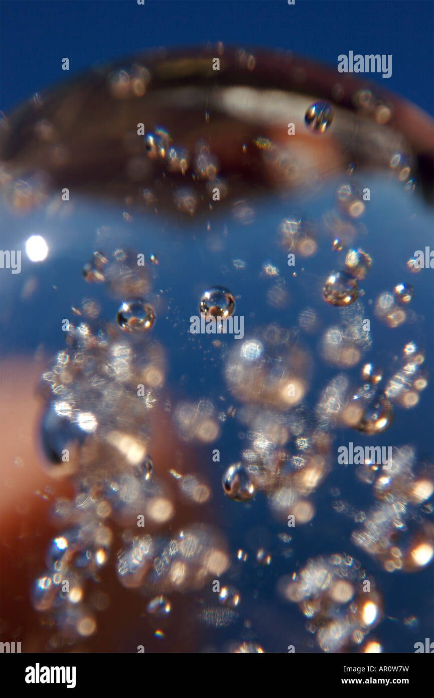 Glass Ball with Bubbles reflecting a hand Stock Photo - Alamy