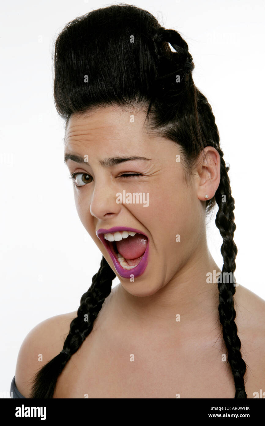 Excited female winking Stock Photo - Alamy