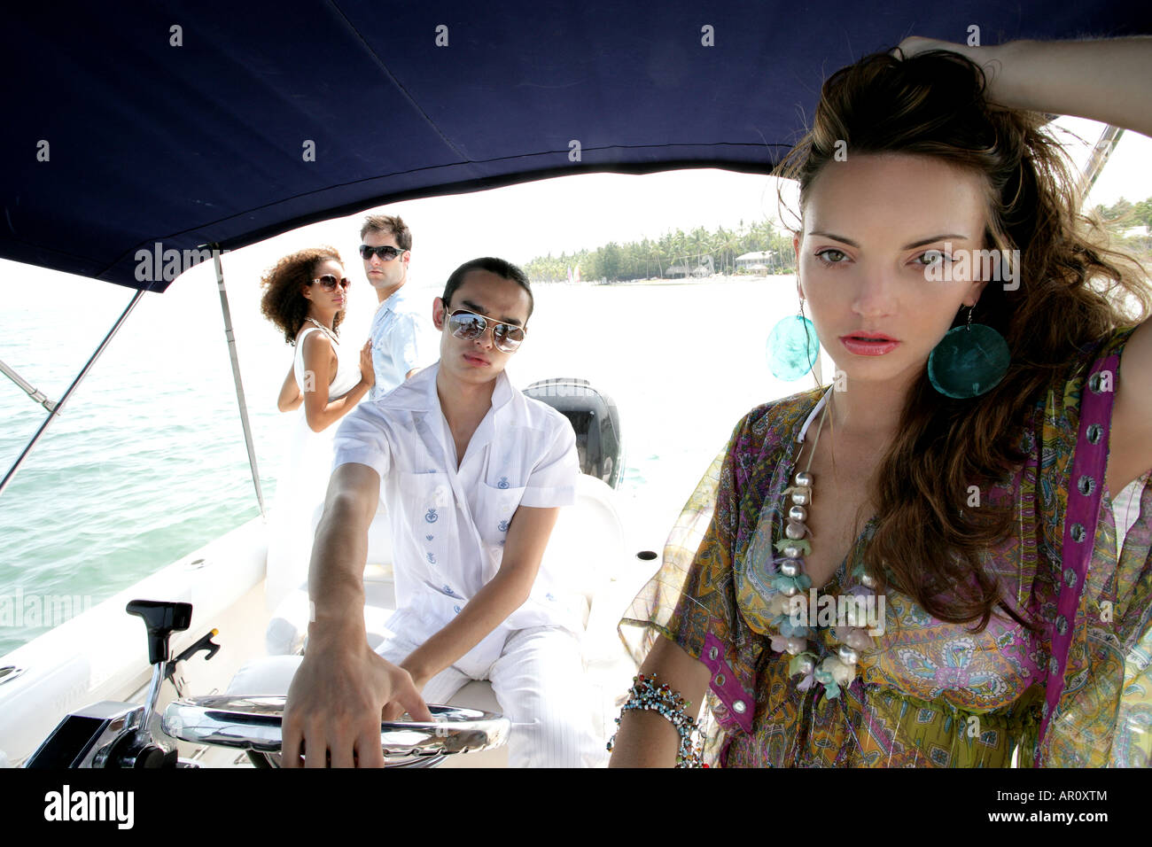 Friends relaxing on boat Stock Photo - Alamy