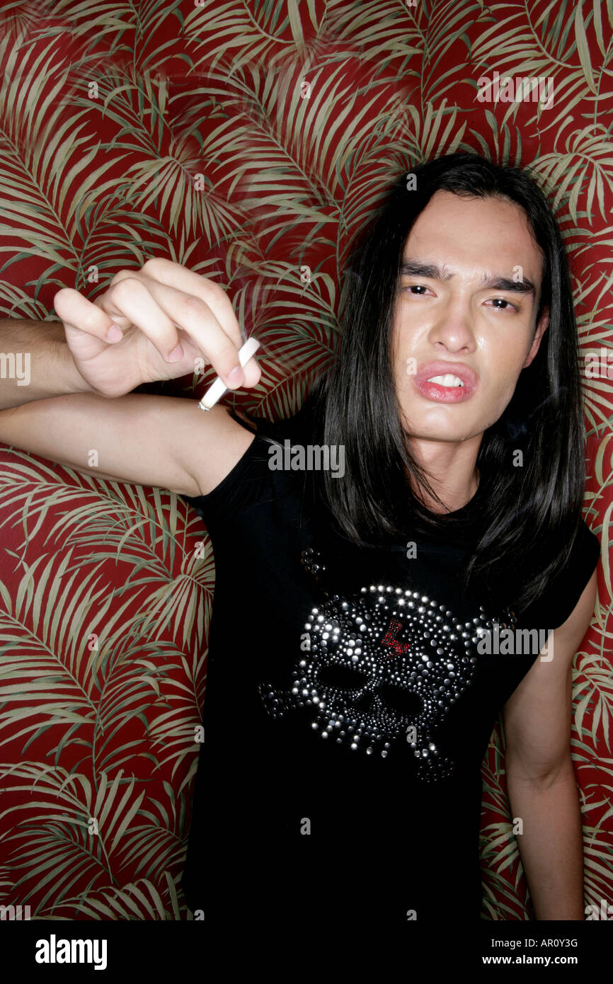 Young punk holding cigarette Stock Photo - Alamy